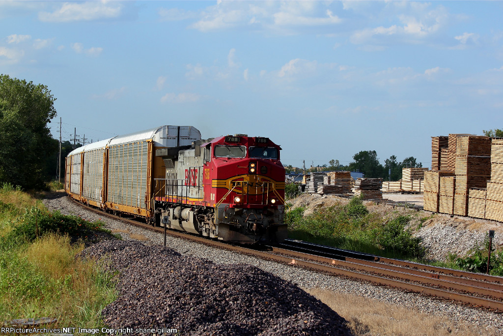 BNSF 788 leads a SB auto train round the mp 52 curve.